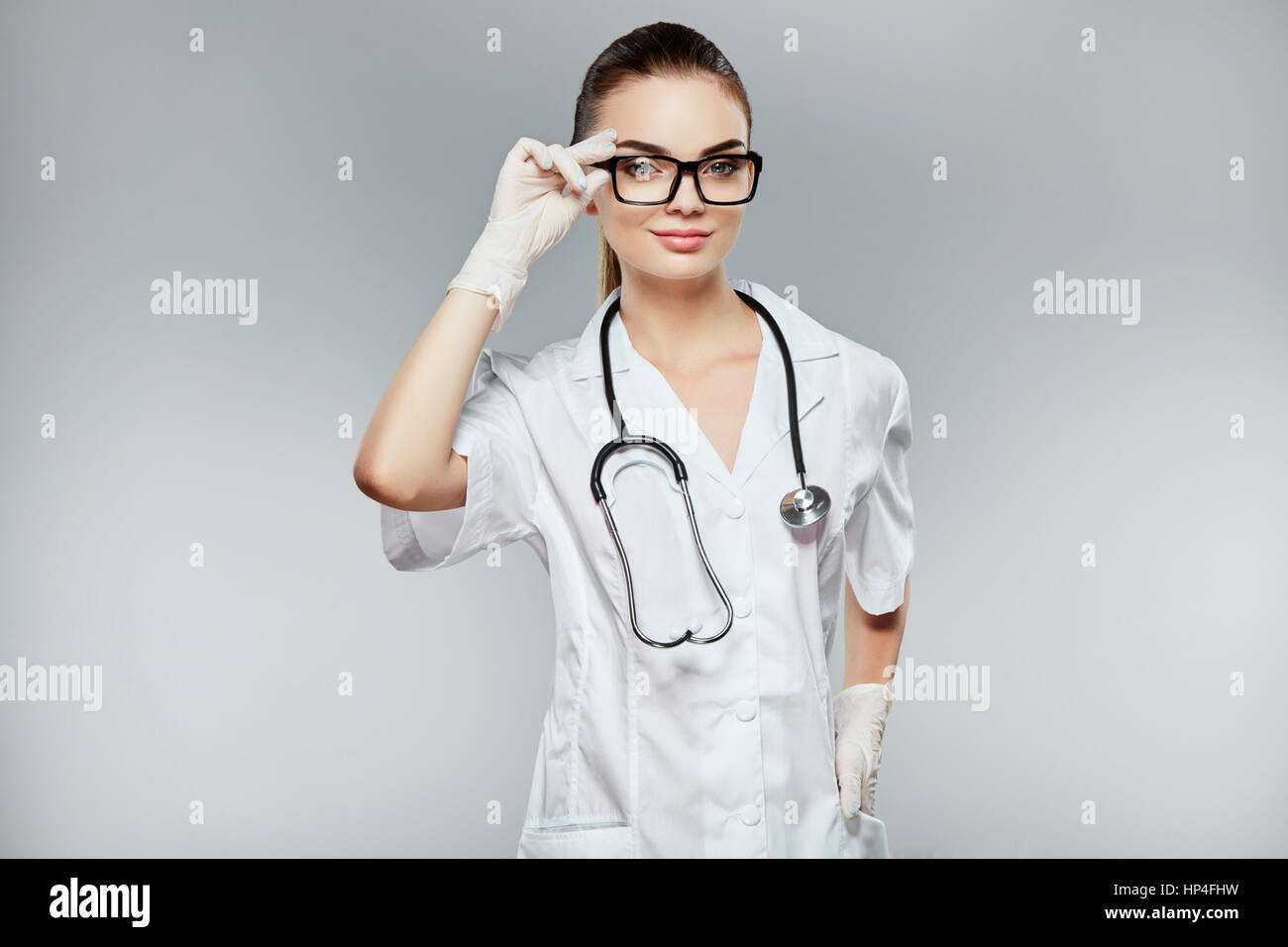 Beautiful nurse in white medical robe Stock Photo - Alamy