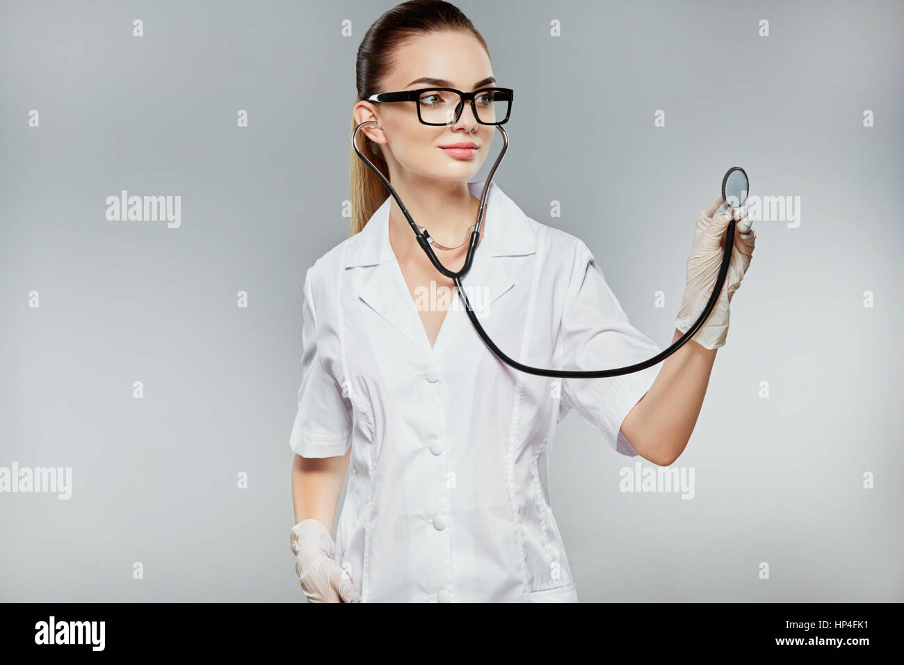 Beautiful nurse in white medical robe Stock Photo - Alamy