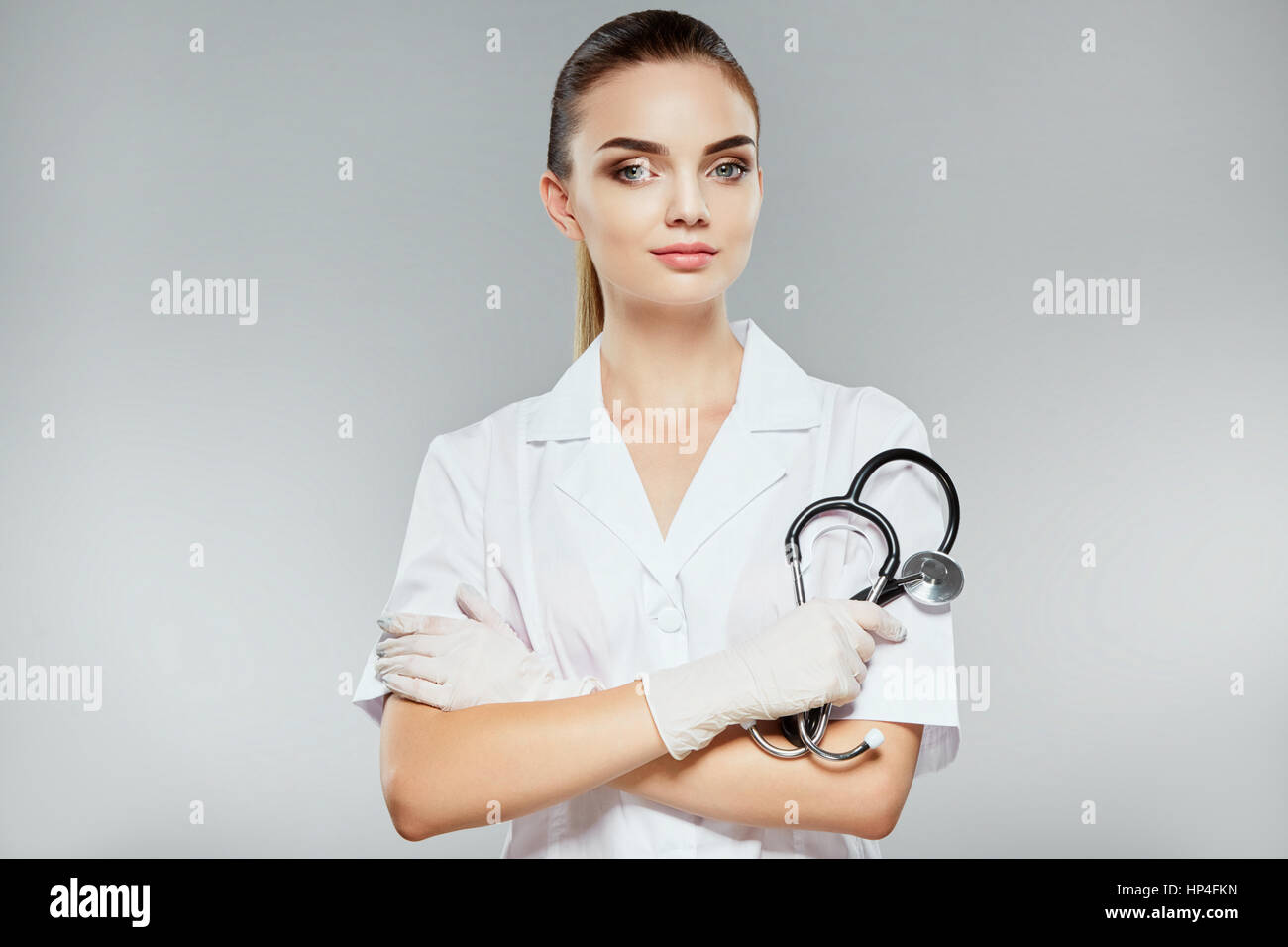 Beautiful nurse in white medical robe Stock Photo - Alamy