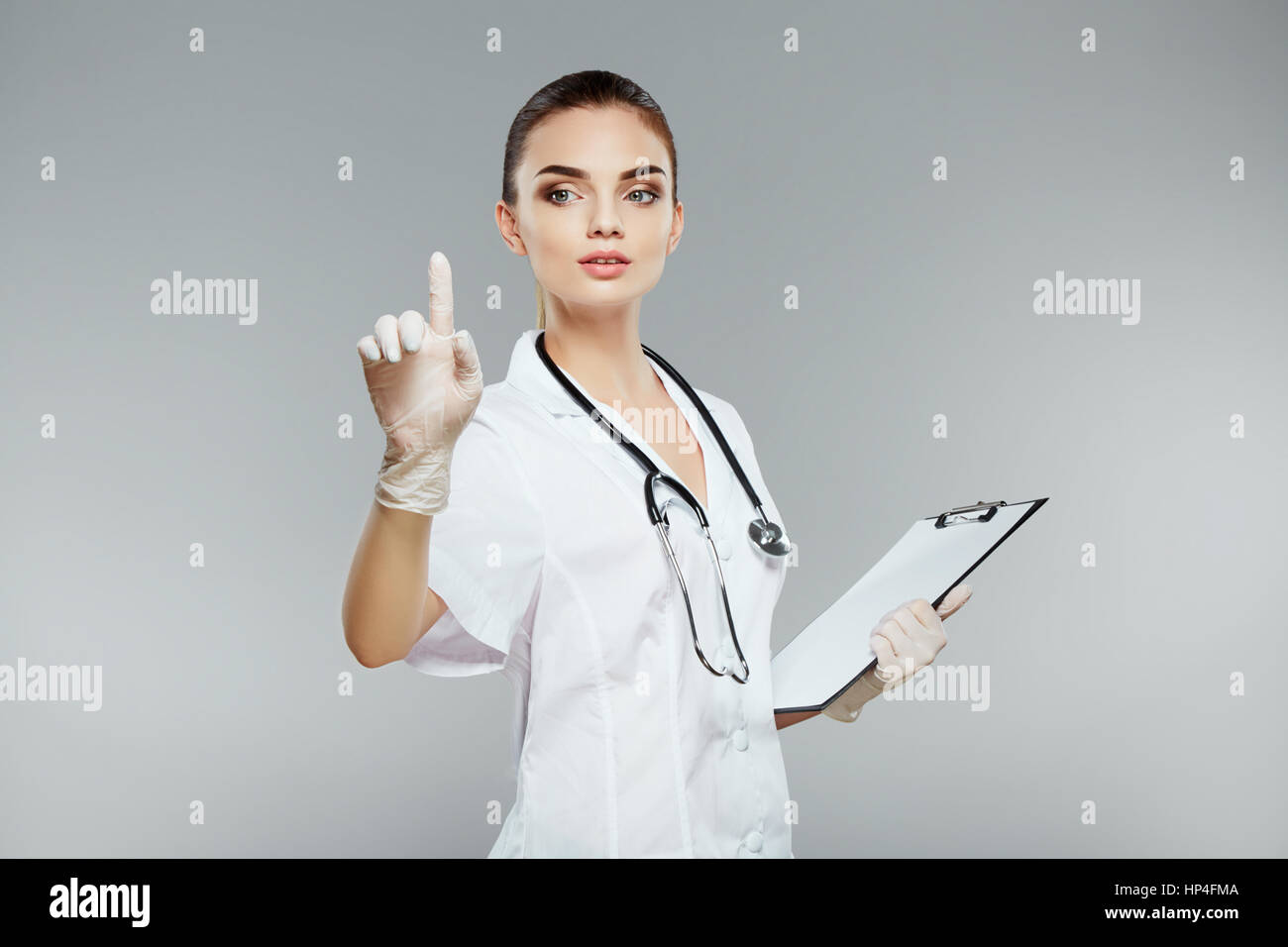 Beautiful nurse in white medical robe Stock Photo - Alamy