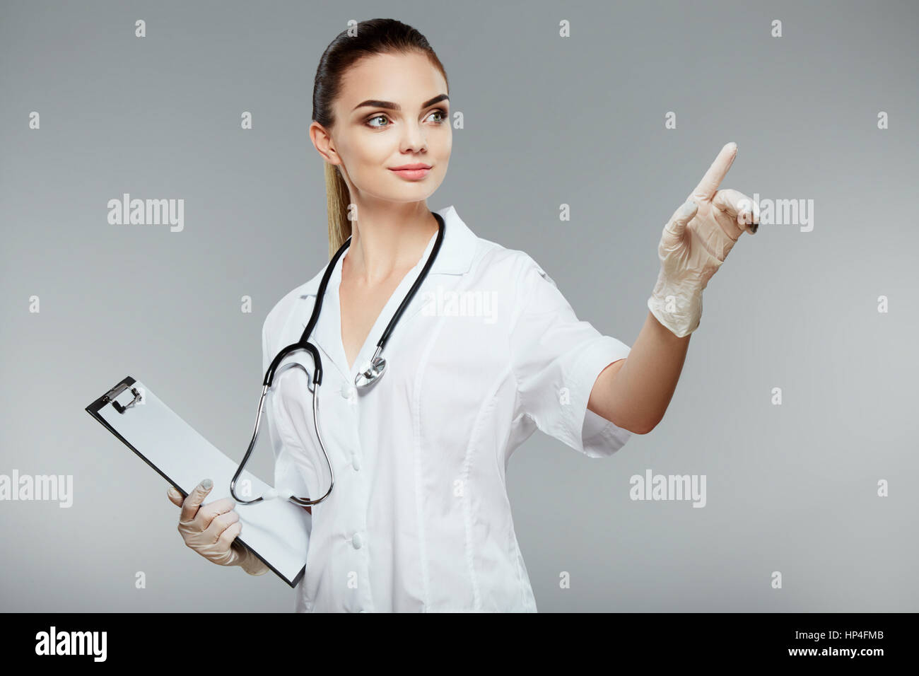 Beautiful nurse in white medical robe Stock Photo - Alamy