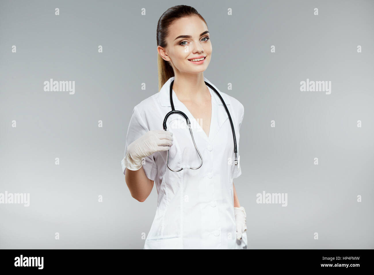 Beautiful nurse in white medical robe Stock Photo - Alamy