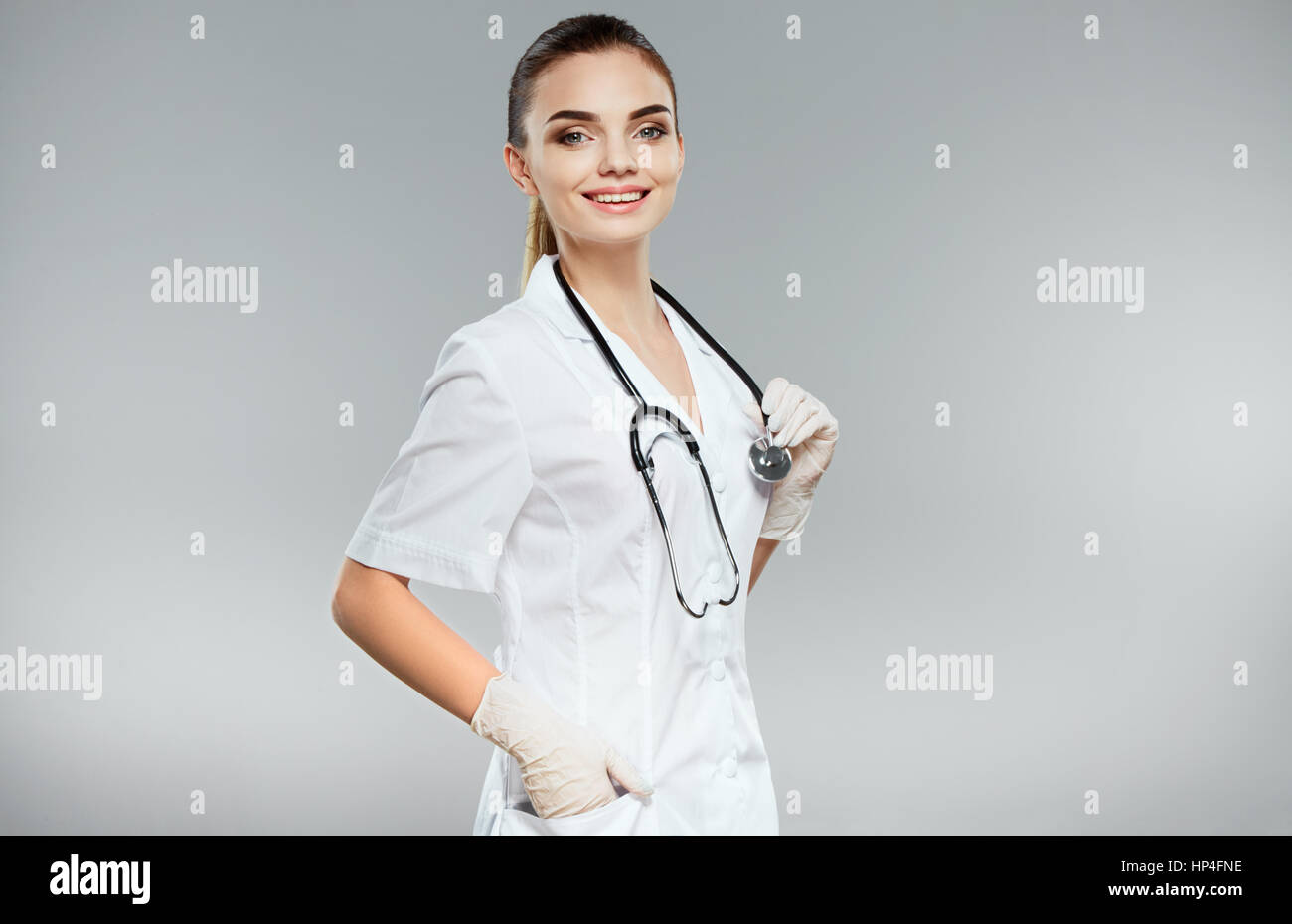 Beautiful nurse in white medical robe Stock Photo - Alamy