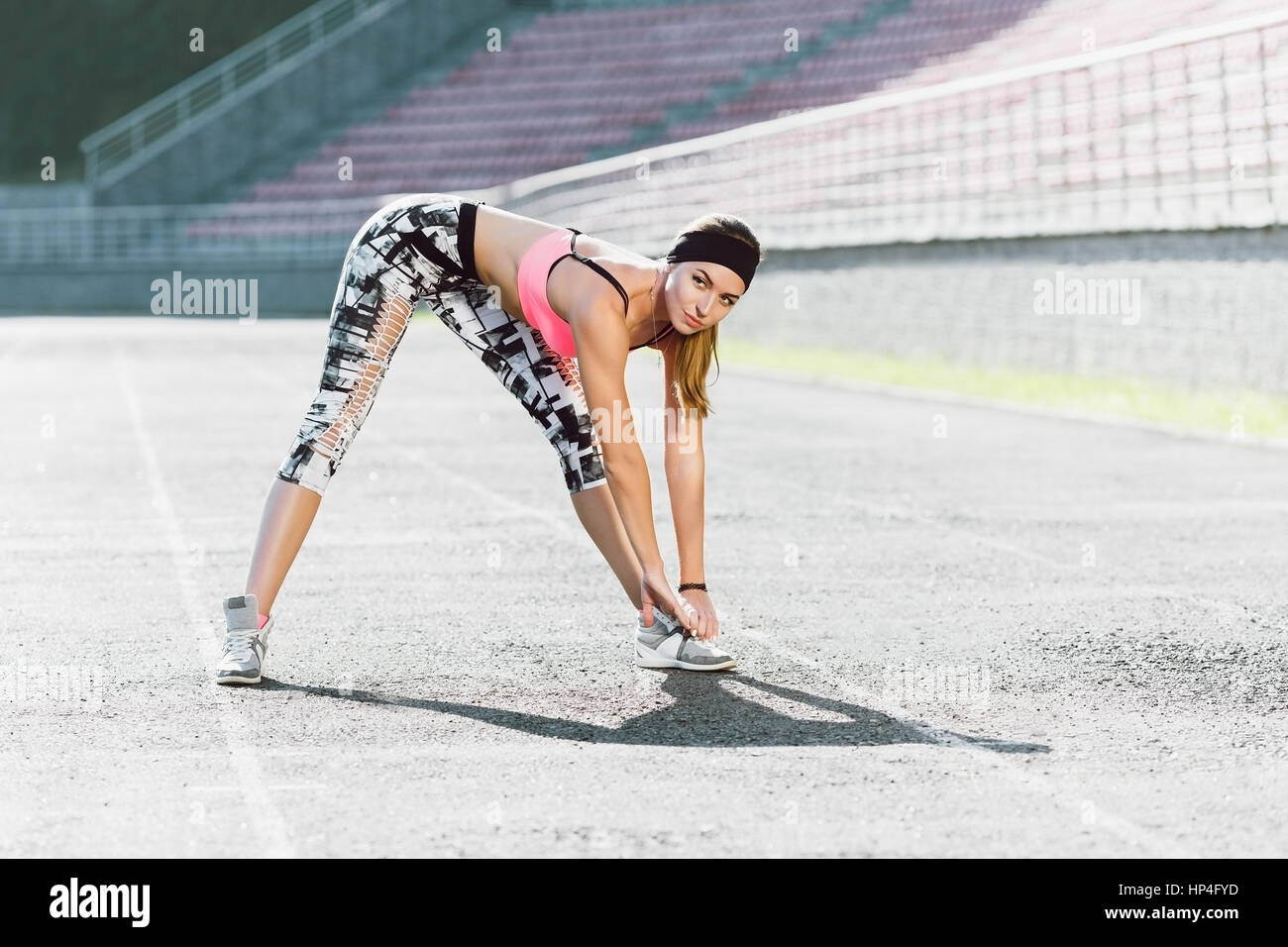 Young girl bending to toes Stock Photo - Alamy