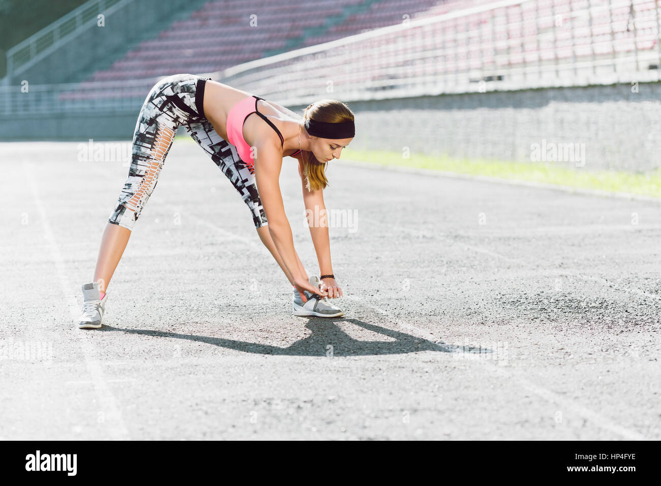 Girl bending to toes Stock Photo - Alamy