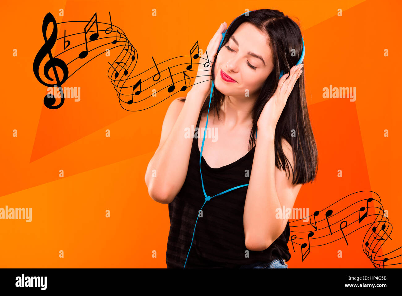 brunette girl with blue headphones and with musical notes Stock Photo ...