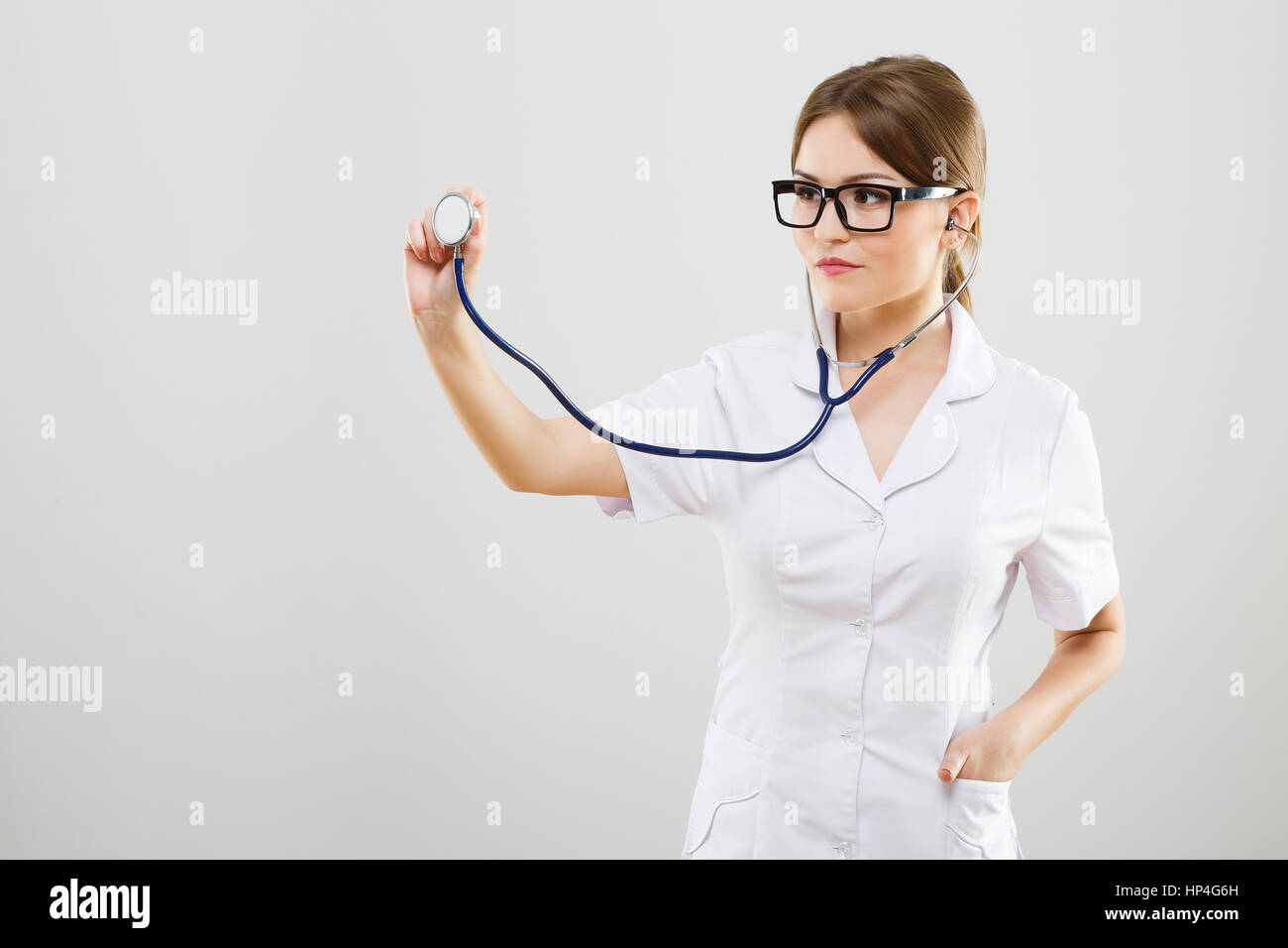 Beautiful nurse in white medical robe Stock Photo - Alamy