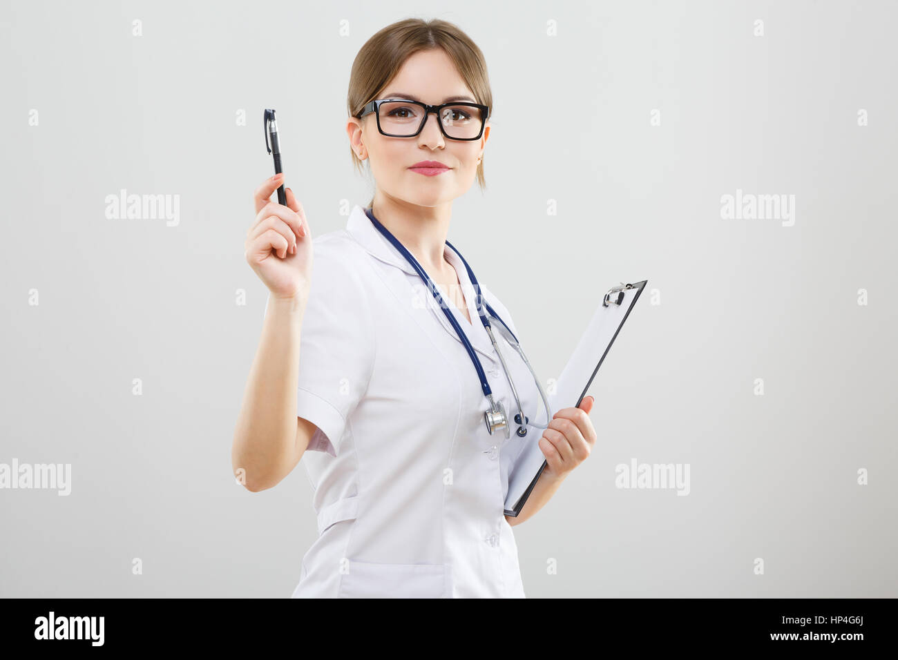 Beautiful nurse in white medical robe Stock Photo - Alamy