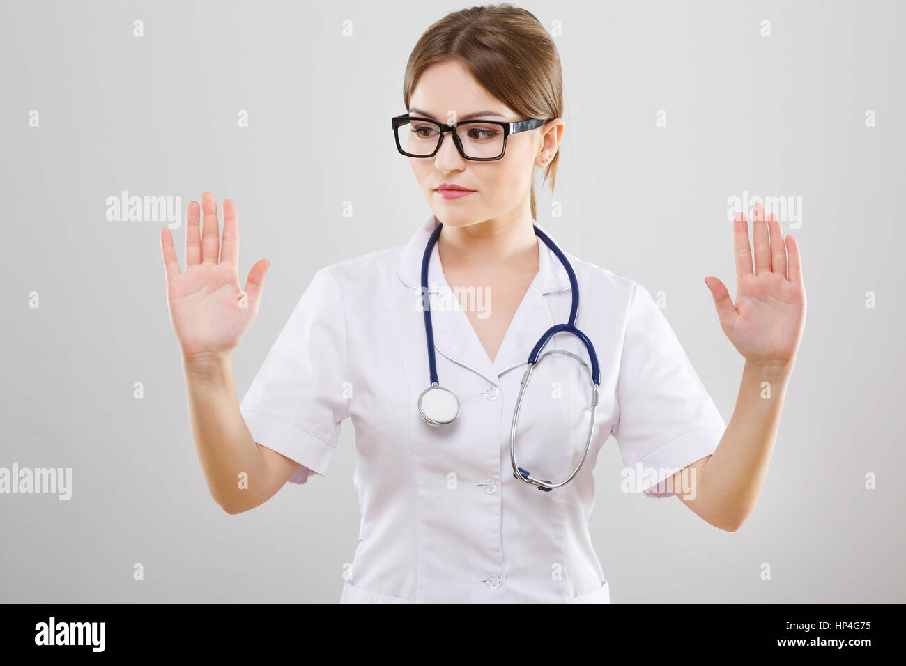 Beautiful nurse in white medical robe Stock Photo - Alamy