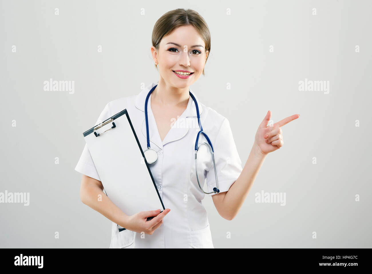 Beautiful nurse in white medical robe Stock Photo - Alamy
