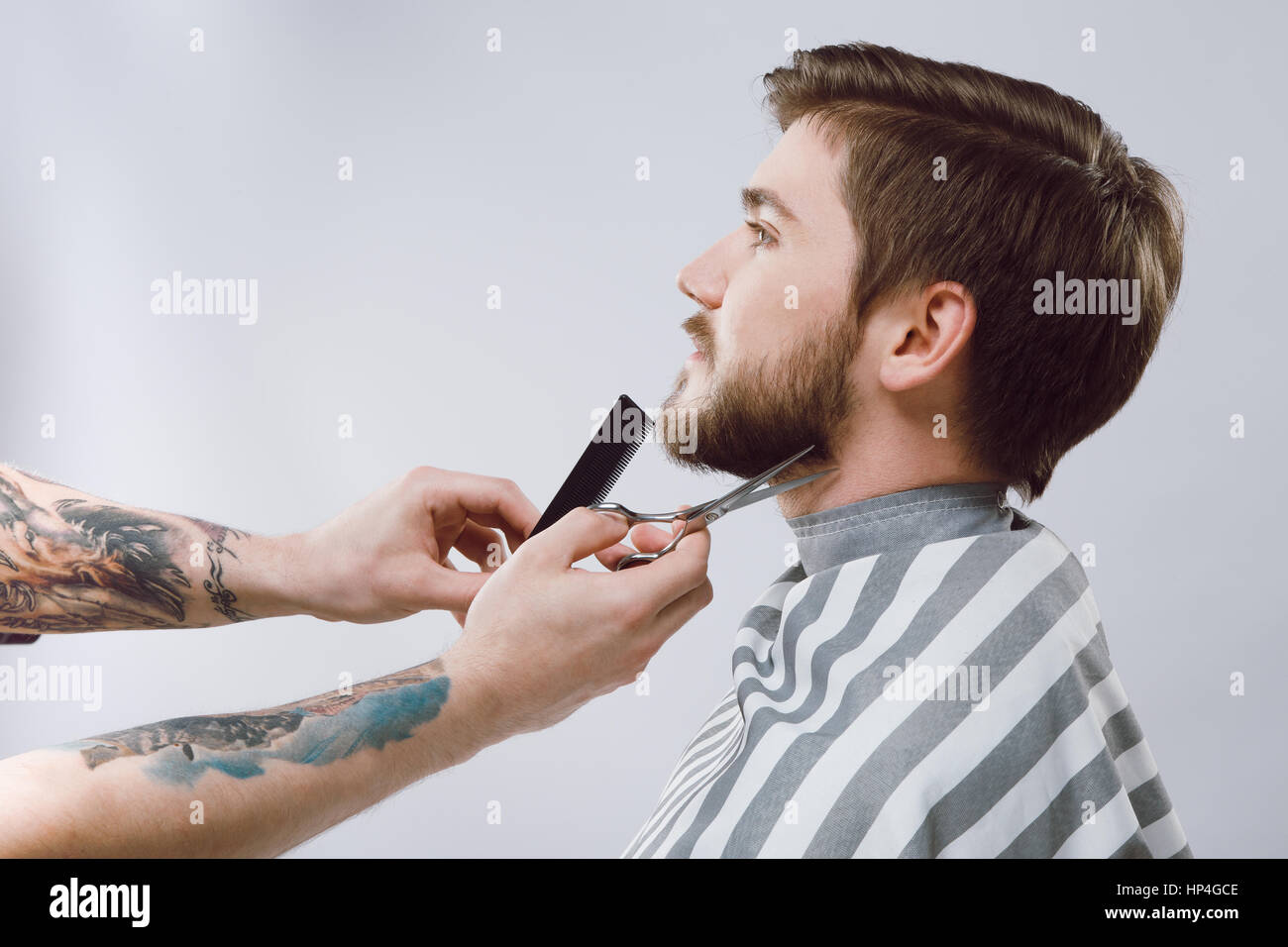 Barber doing a beard form Stock Photo - Alamy