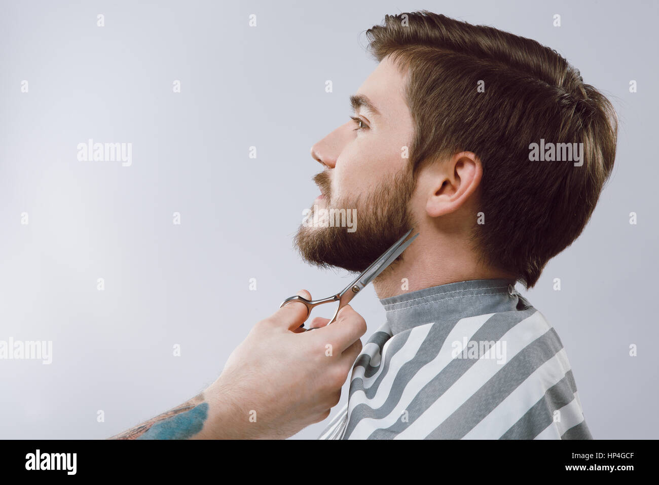Barber doing a beard form Stock Photo - Alamy