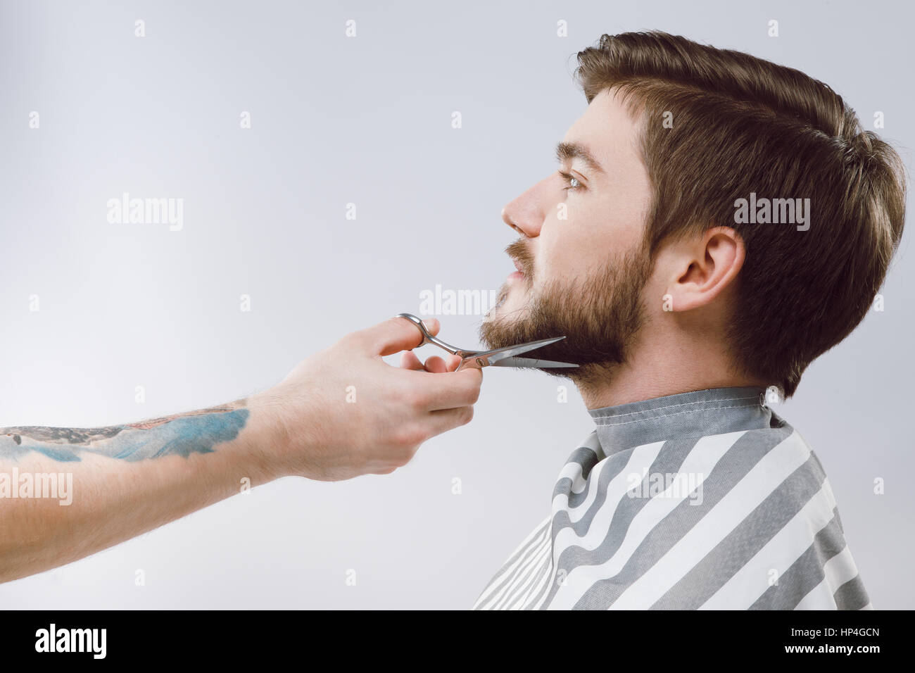 Barber doing a beard form Stock Photo - Alamy