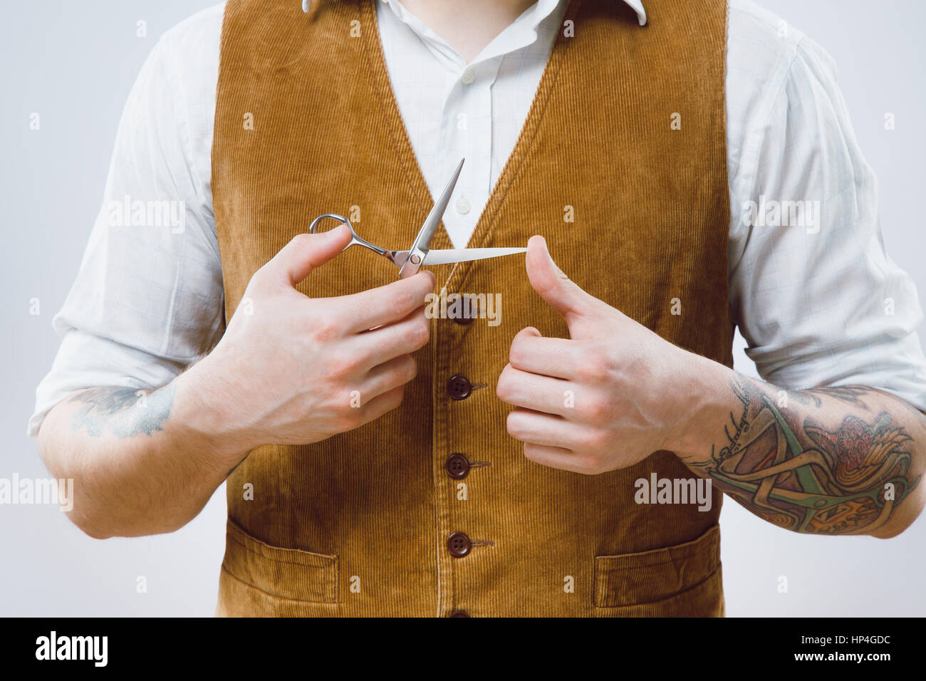 Barber's hands with scissors Stock Photo - Alamy