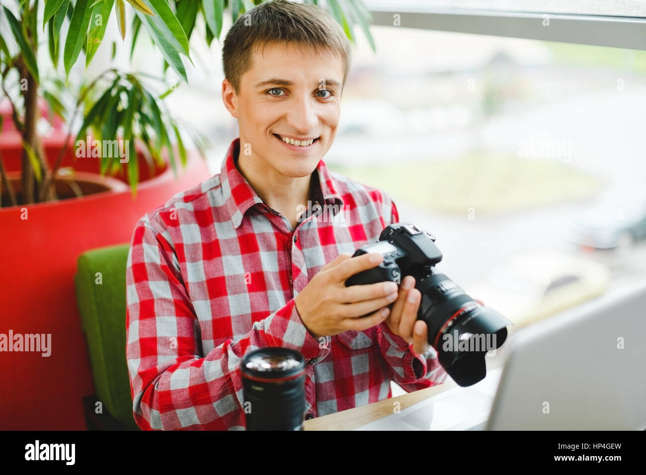Man sitting with laptop Stock Photo - Alamy