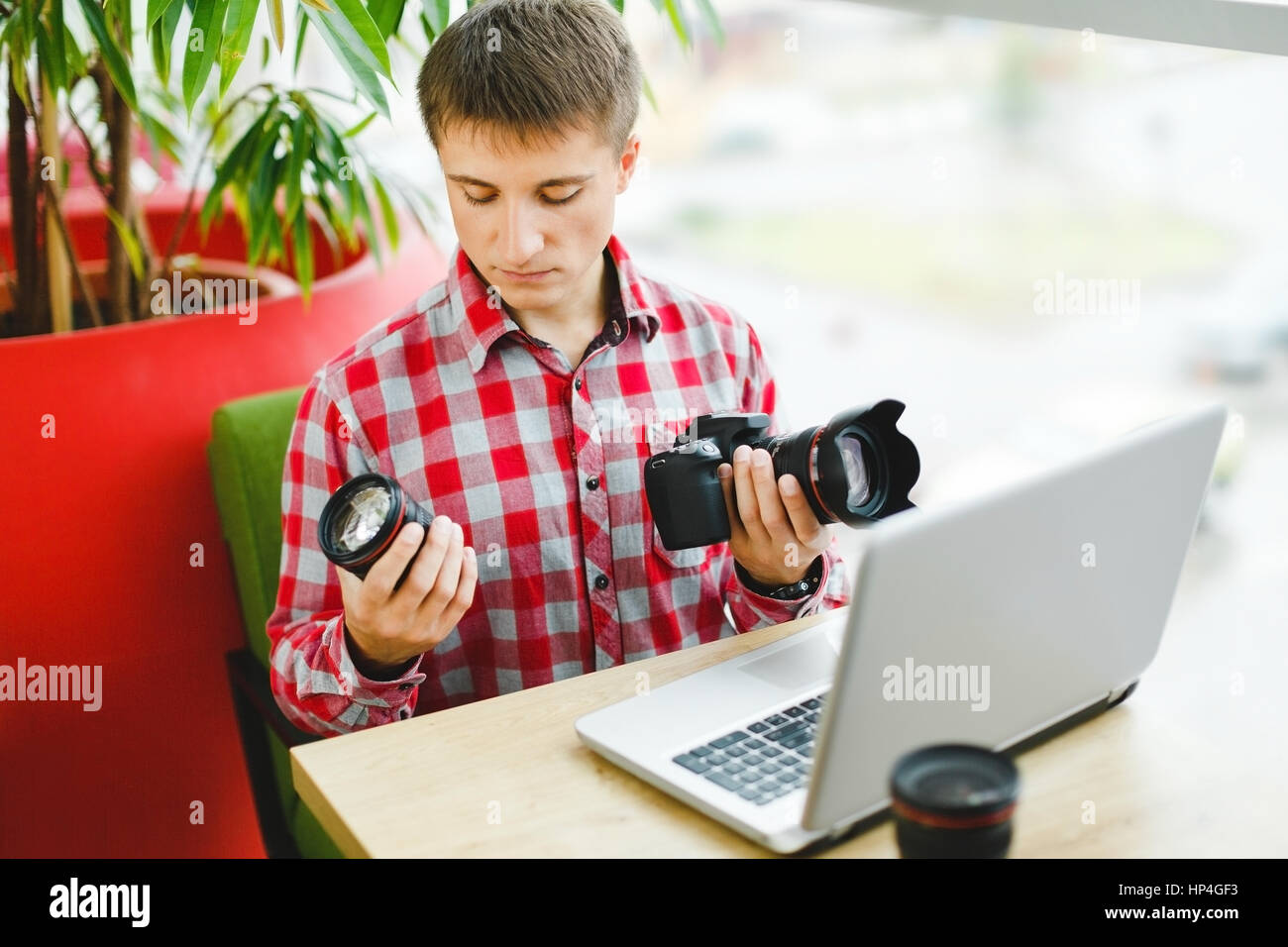 Man sitting with laptop Stock Photo - Alamy