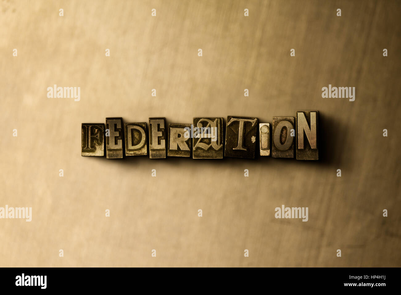 FEDERATION - close-up of grungy vintage typeset word on metal backdrop ...