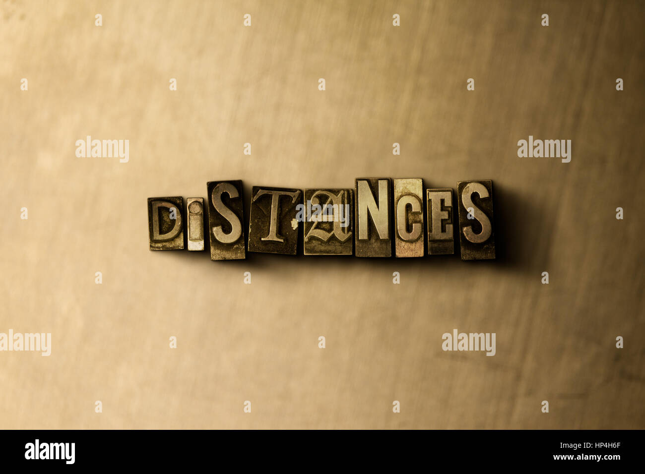 DISTANCES - close-up of grungy vintage typeset word on metal backdrop ...
