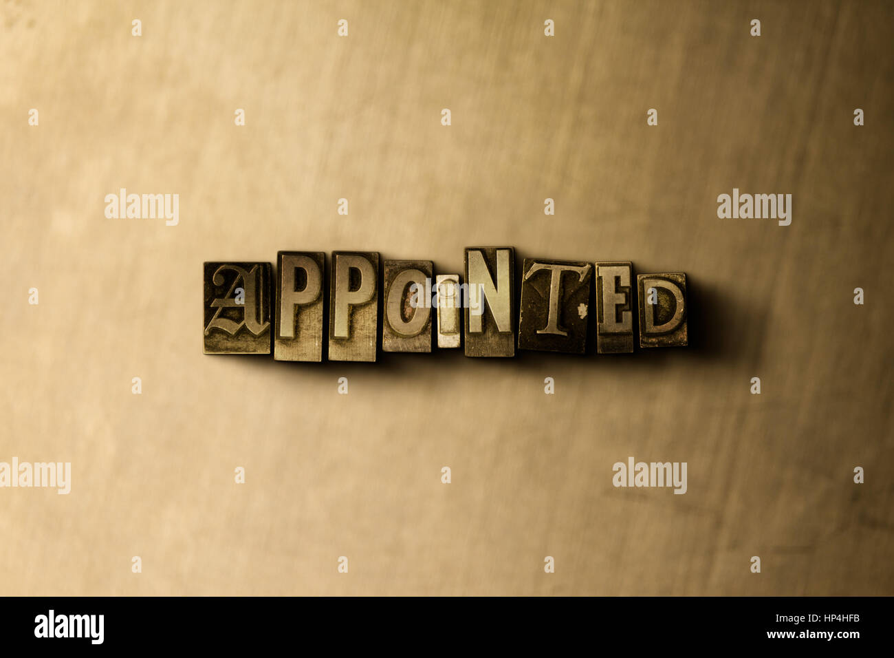 APPOINTED - close-up of grungy vintage typeset word on metal backdrop ...