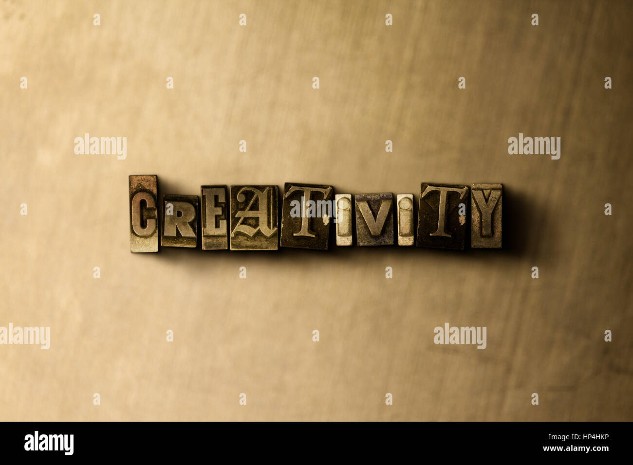 CREATIVITY - close-up of grungy vintage typeset word on metal backdrop ...