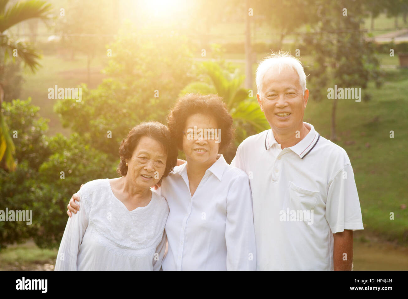 Group of healthy Asian seniors having activities at outdoor nature park ...