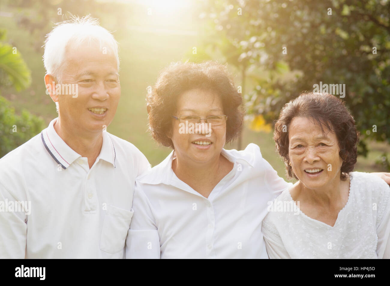 Group of healthy Asian seniors having fun at outdoor nature park, in ...