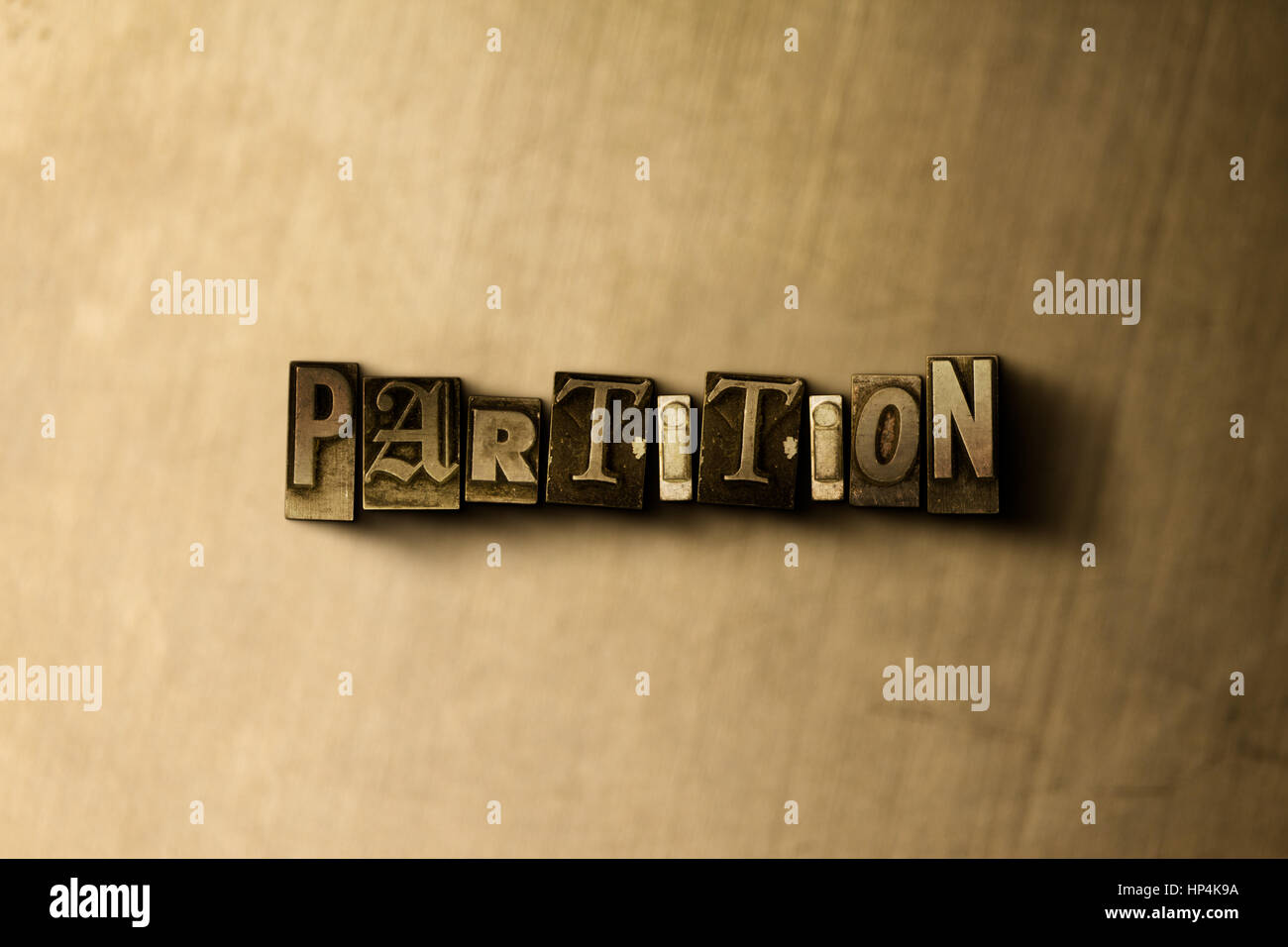 PARTITION - close-up of grungy vintage typeset word on metal backdrop ...