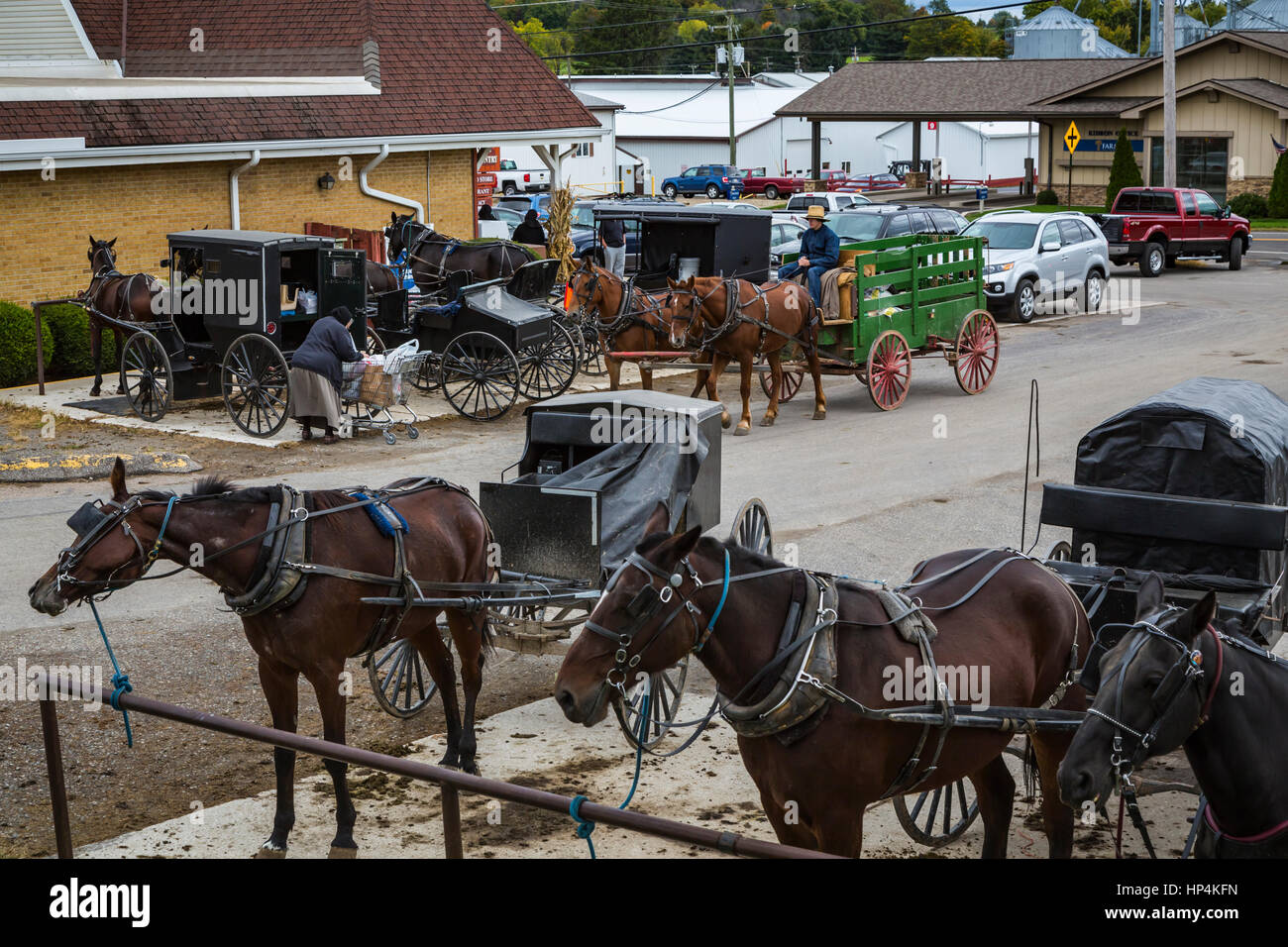 Amish horse and buggies at a hitching post in Dalton, Ohio, USA Stock ...