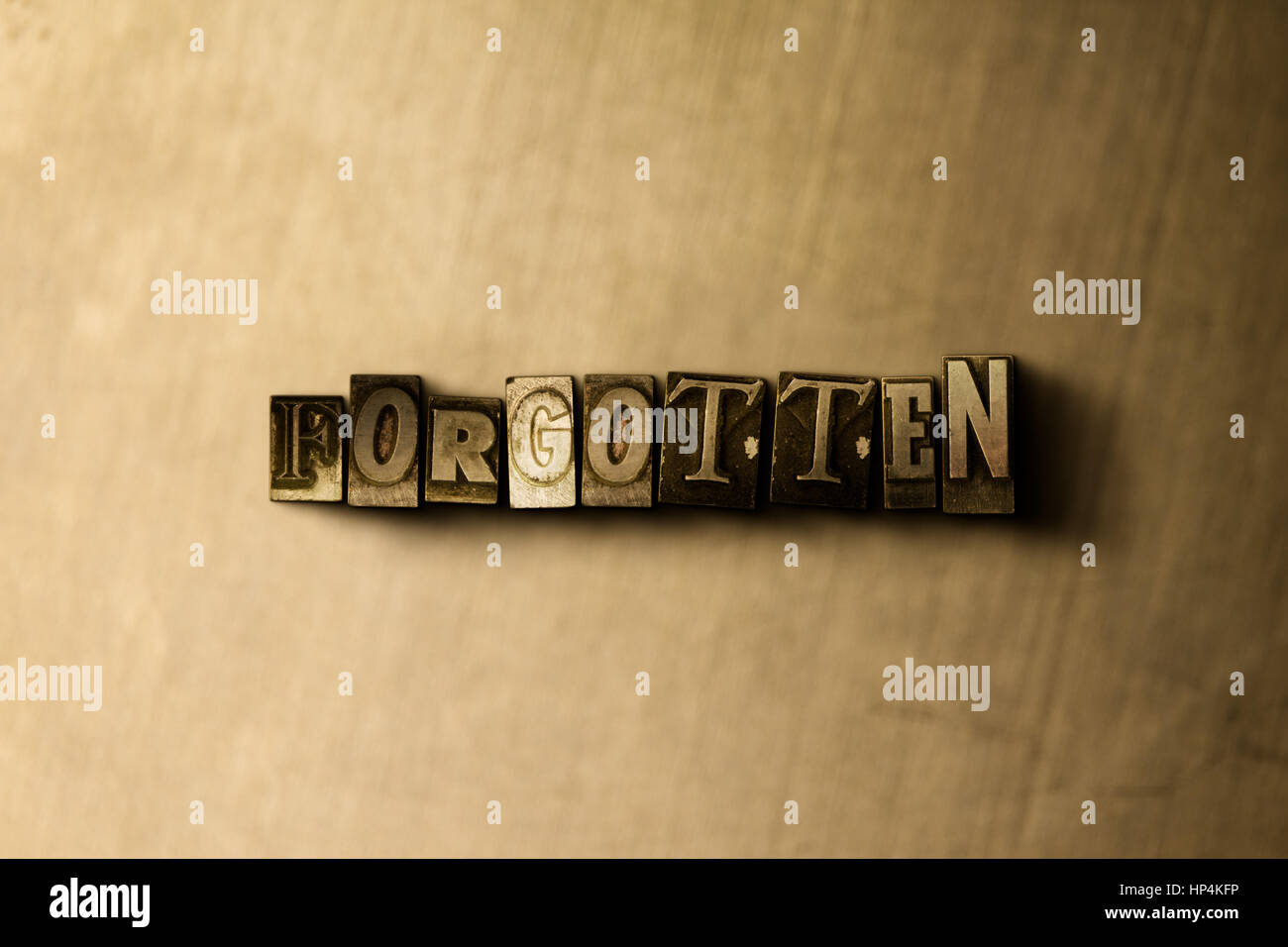 FORGOTTEN - close-up of grungy vintage typeset word on metal backdrop ...