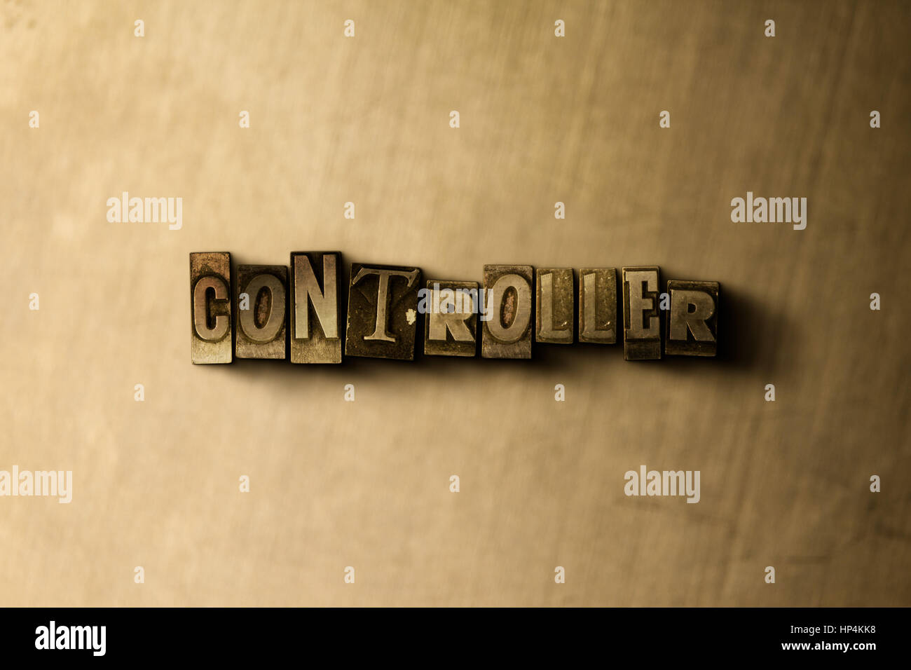 CONTROLLER - close-up of grungy vintage typeset word on metal backdrop ...