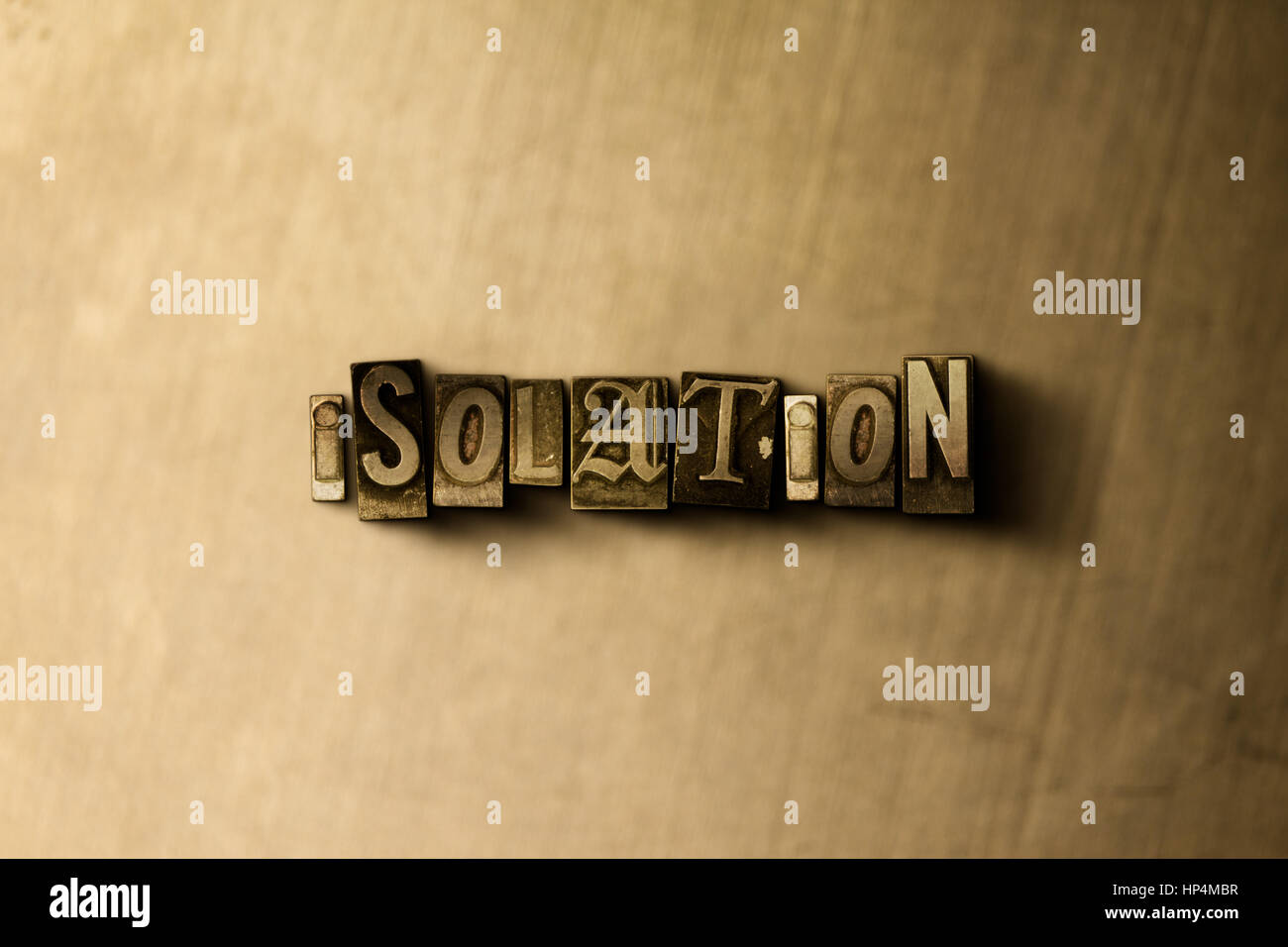ISOLATION - close-up of grungy vintage typeset word on metal backdrop ...