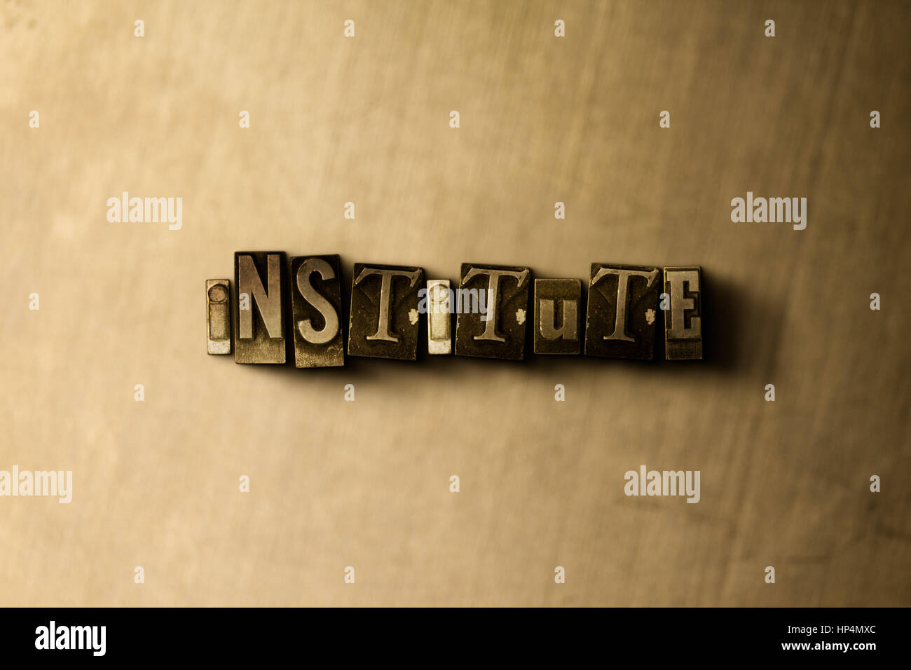 INSTITUTE - close-up of grungy vintage typeset word on metal backdrop ...
