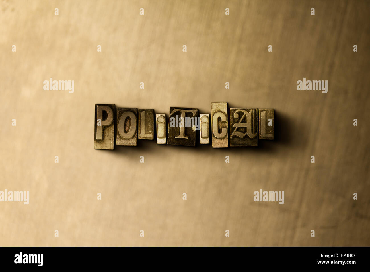 POLITICAL - close-up of grungy vintage typeset word on metal backdrop ...