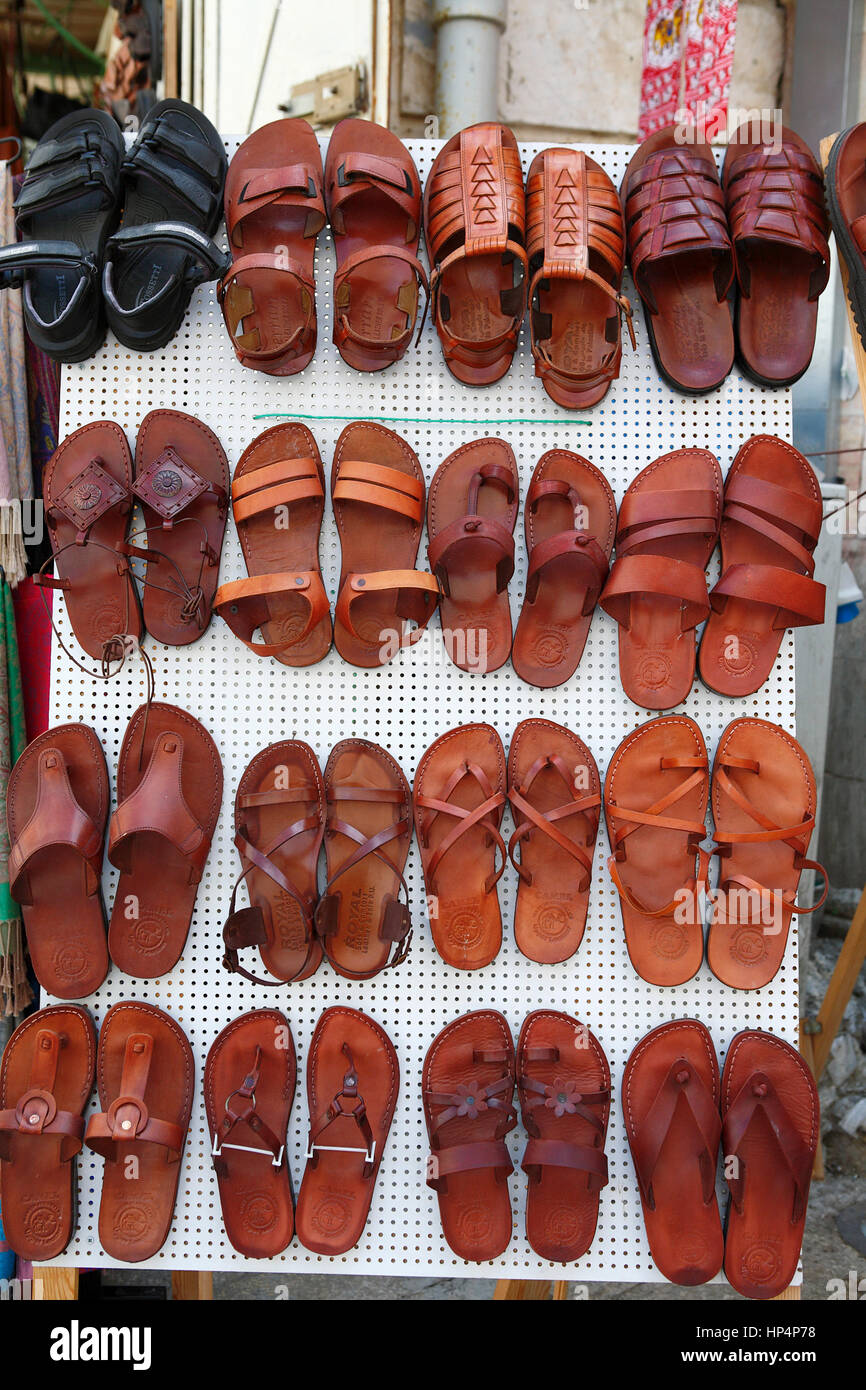 close up of open-toed pilgrim sandals in shop window, old city ...