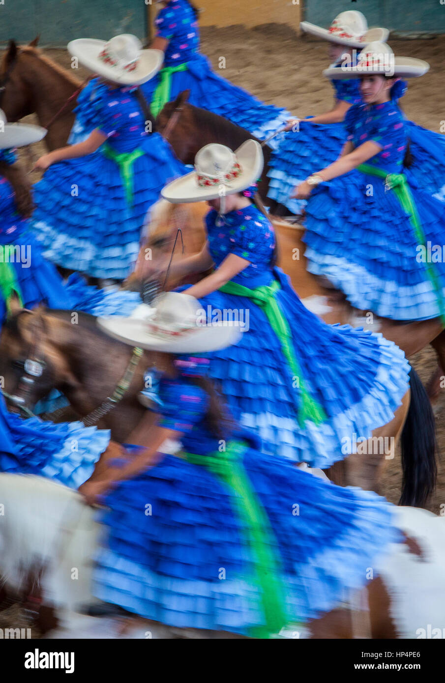 Escaramuzas ride their horses. A charreada Mexican rodeo at the Lienzo ...