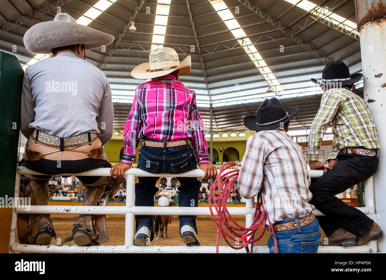Man, men, Spectators watch a charreada Mexican rodeo at the Lienzo ...
