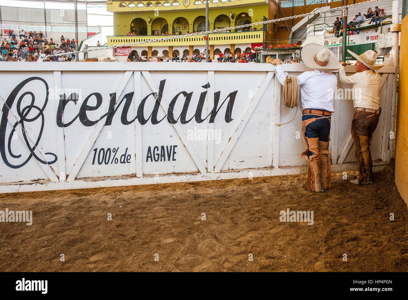 Charros watch a charreada Mexican rodeo at the Lienzo Charro Zermeno ...