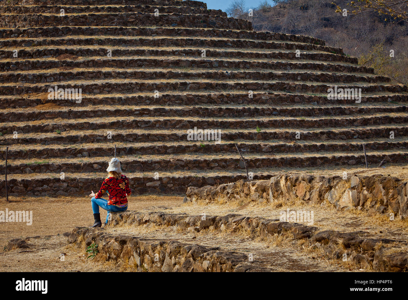 Tourist, in background circular stepped pyramid, Guachimontones ...