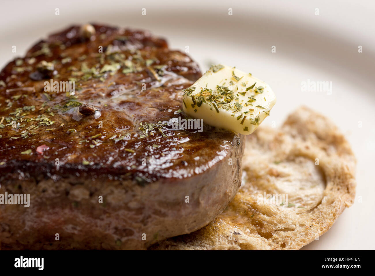Beef Steak Fillet on Toasted Baguette Bread with Melting Butter and ...