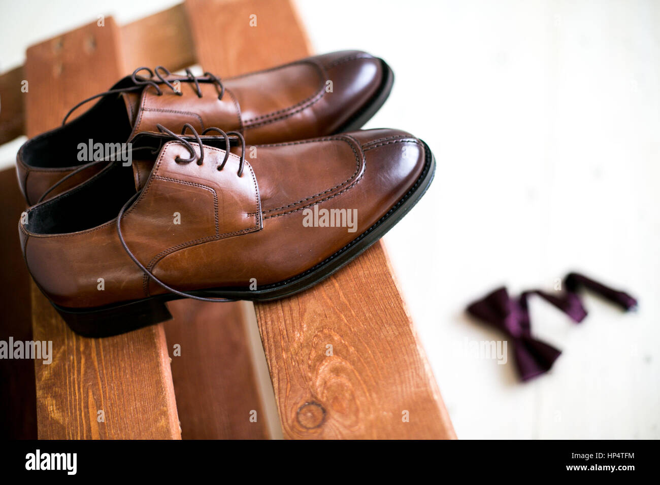 shoes stacked in composition on a black desk Stock Photo - Alamy