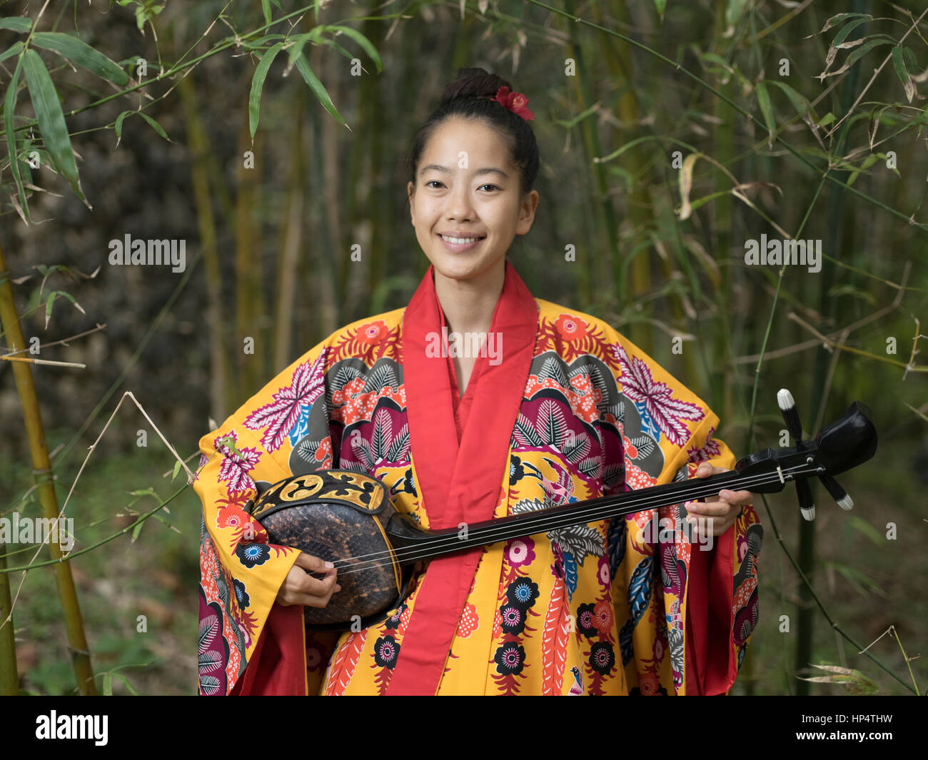 Okinawa musician Nayuta Hirano with sanshin (instrument) and ...