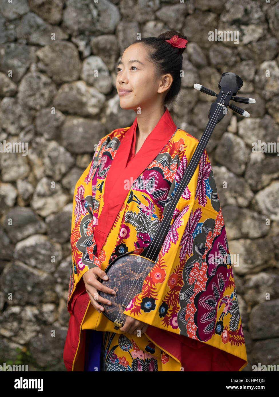 Okinawa musician Nayuta Hirano with sanshin (instrument) and ...