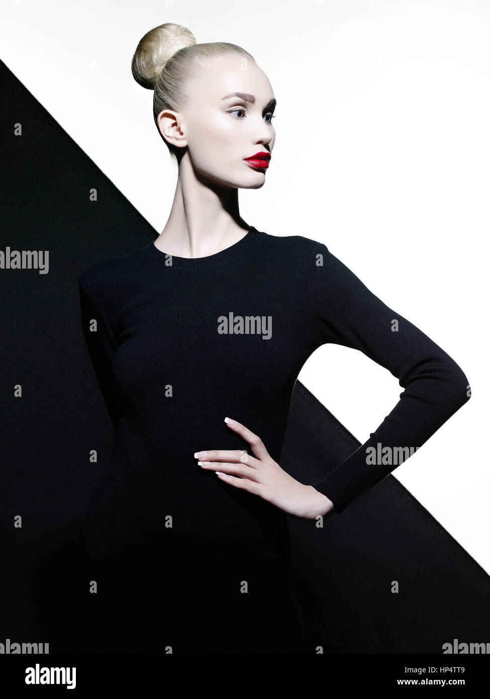 Fashion art studio portrait of elegant blode in geometric black and ...