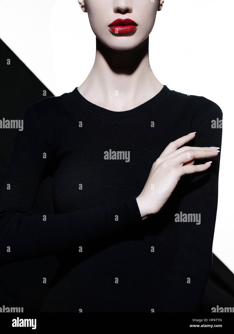Fashion art studio portrait of elegant blode in geometric black and ...