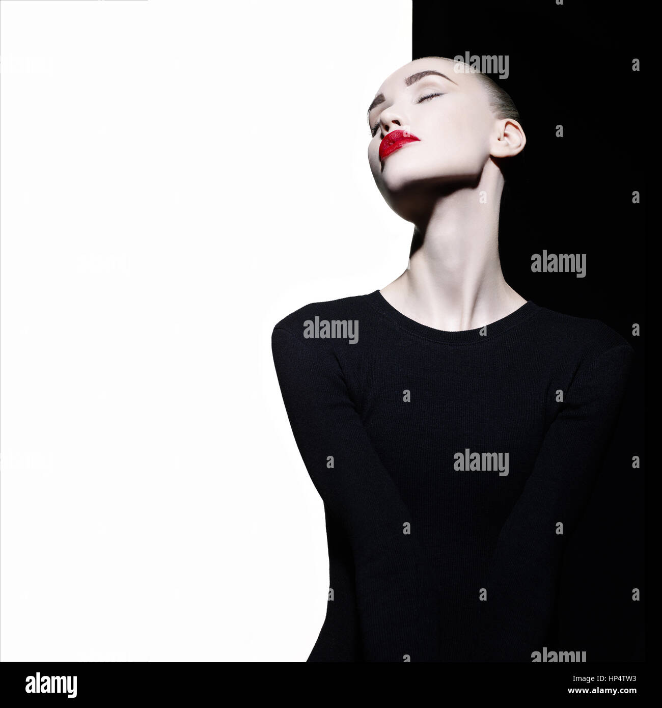 Fashion art studio portrait of elegant blode in geometric black and ...