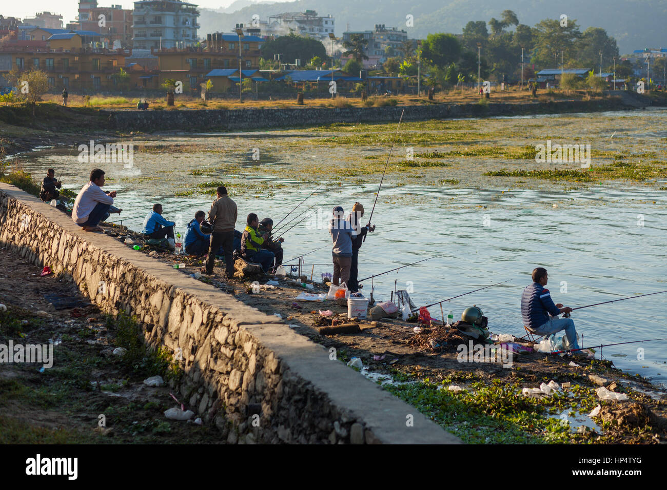 Fisherman in Fewa Lake (Phewa Tal), Pokhara, Nepal Stock Photo - Alamy