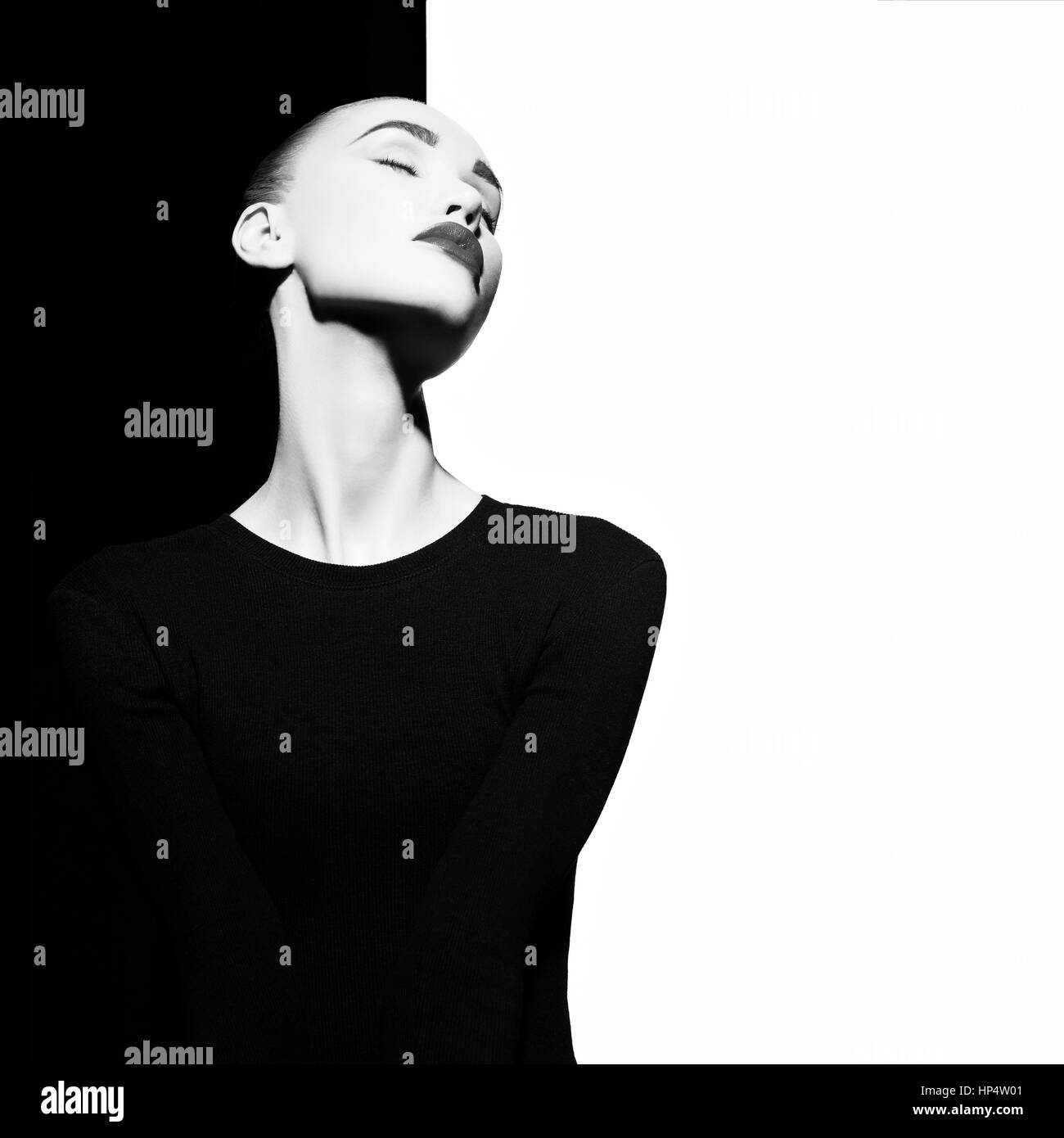 Fashion art studio portrait of elegant blode in geometric black and ...