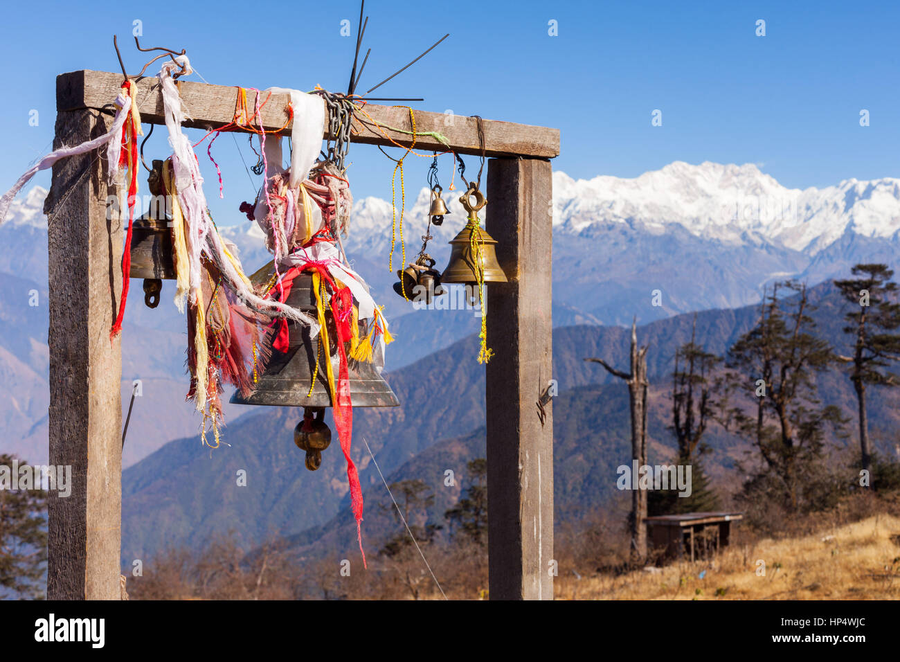 Bells at Pathivara Devi Temple with Kanchenjunga mountain in the ...