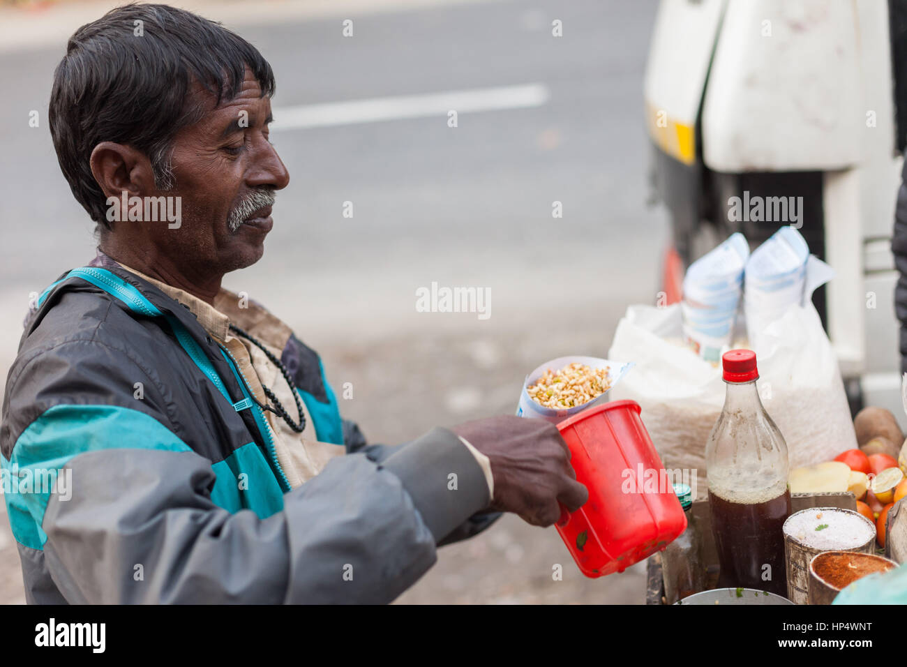 Roadside snack vendor preparing a mix of puffed rice, Nepal Stock Photo ...