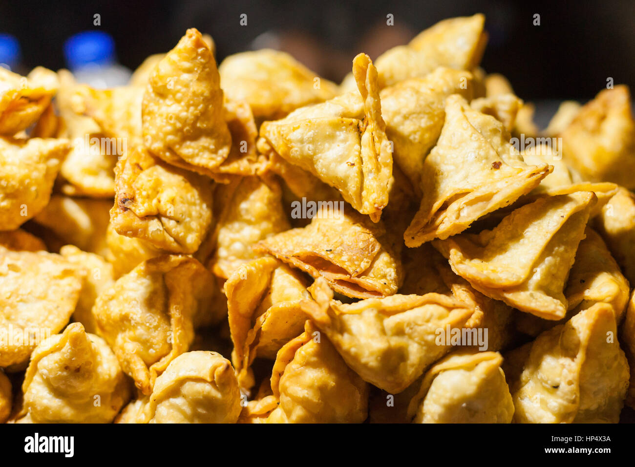 Nepali Samosas stacked at a vendor's stand at night Stock Photo - Alamy
